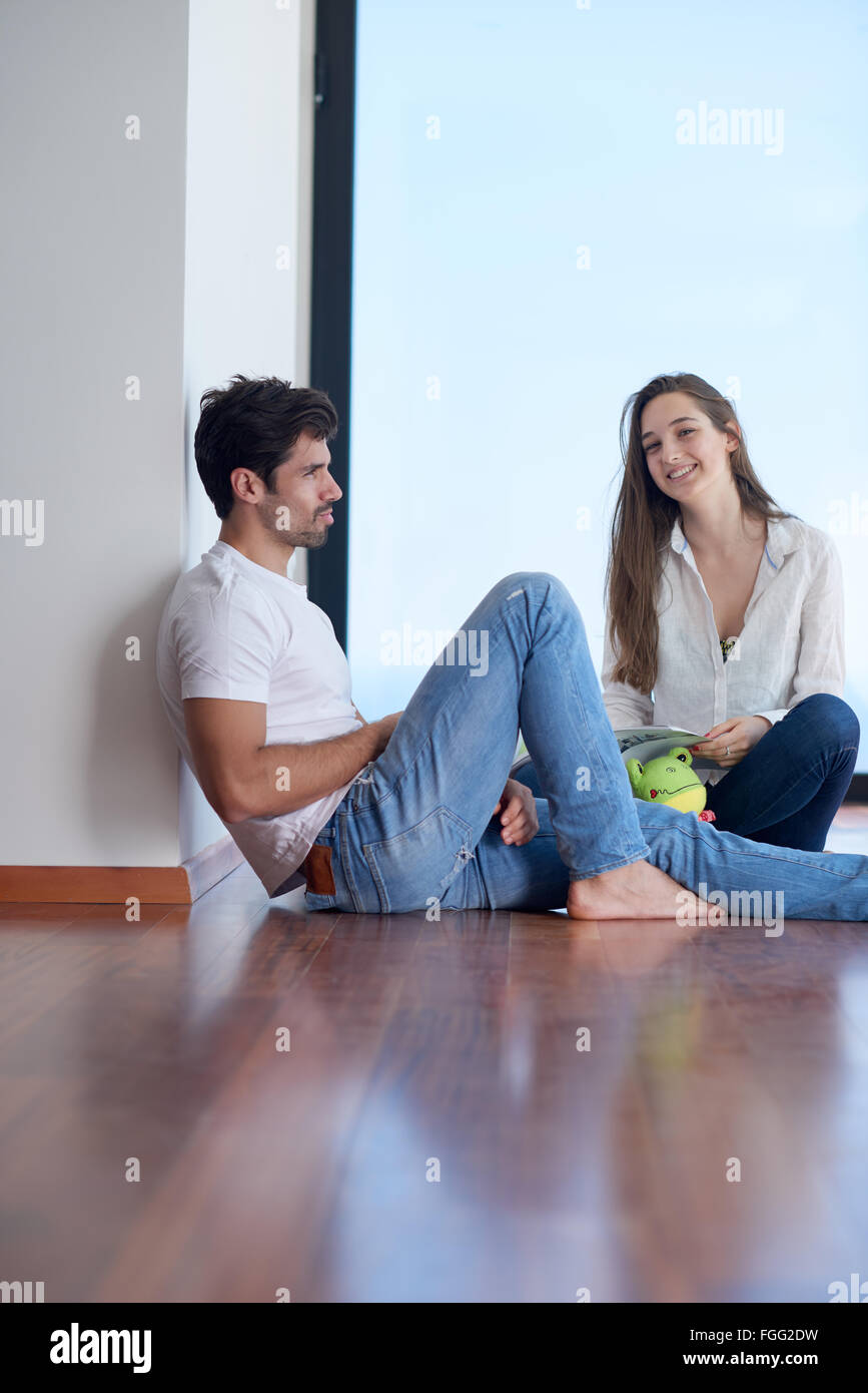relaxed young couple at home staircase Stock Photo - Alamy