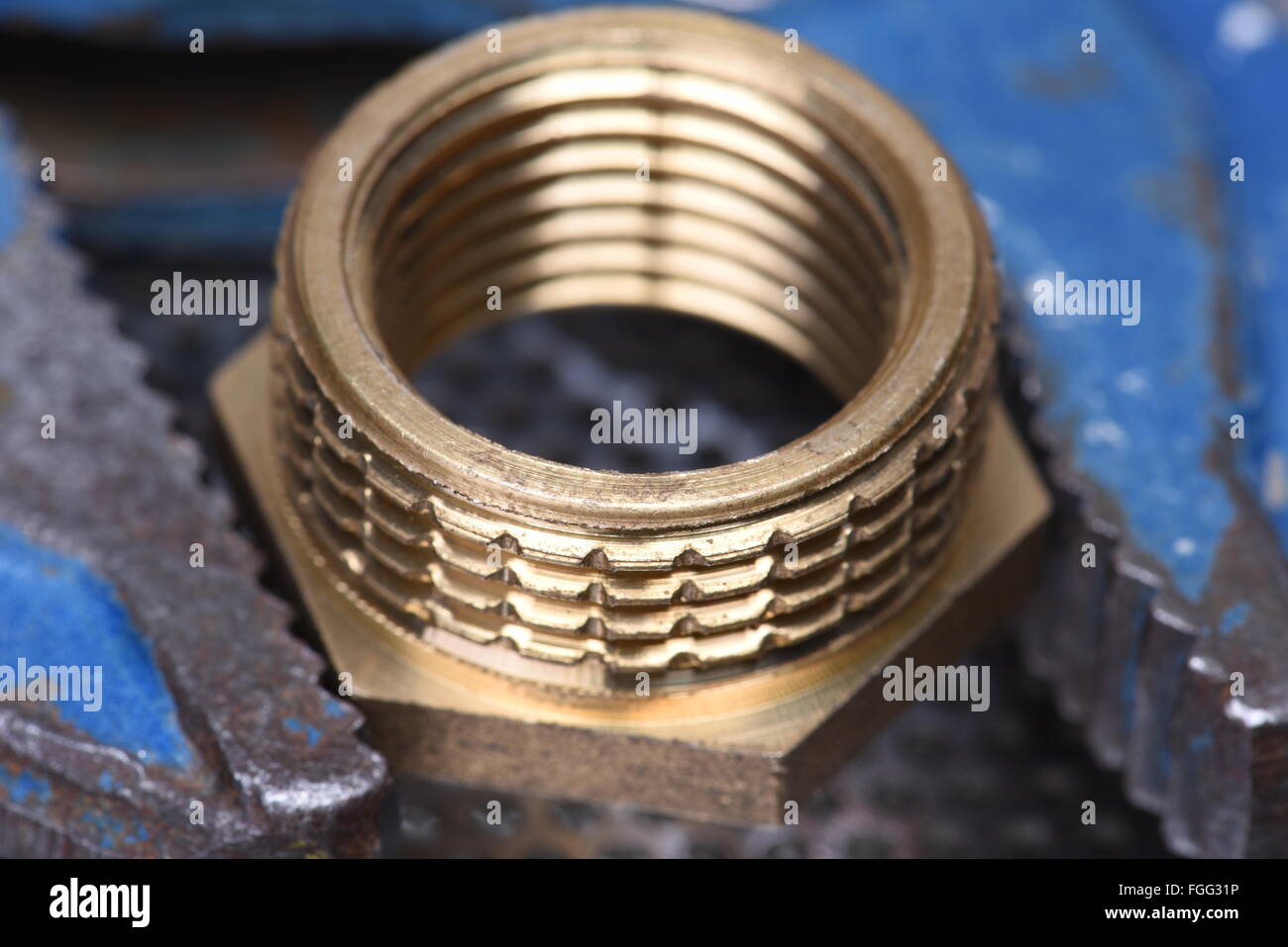Closeup of brass threaded connector nipple with wrench Stock Photo - Alamy