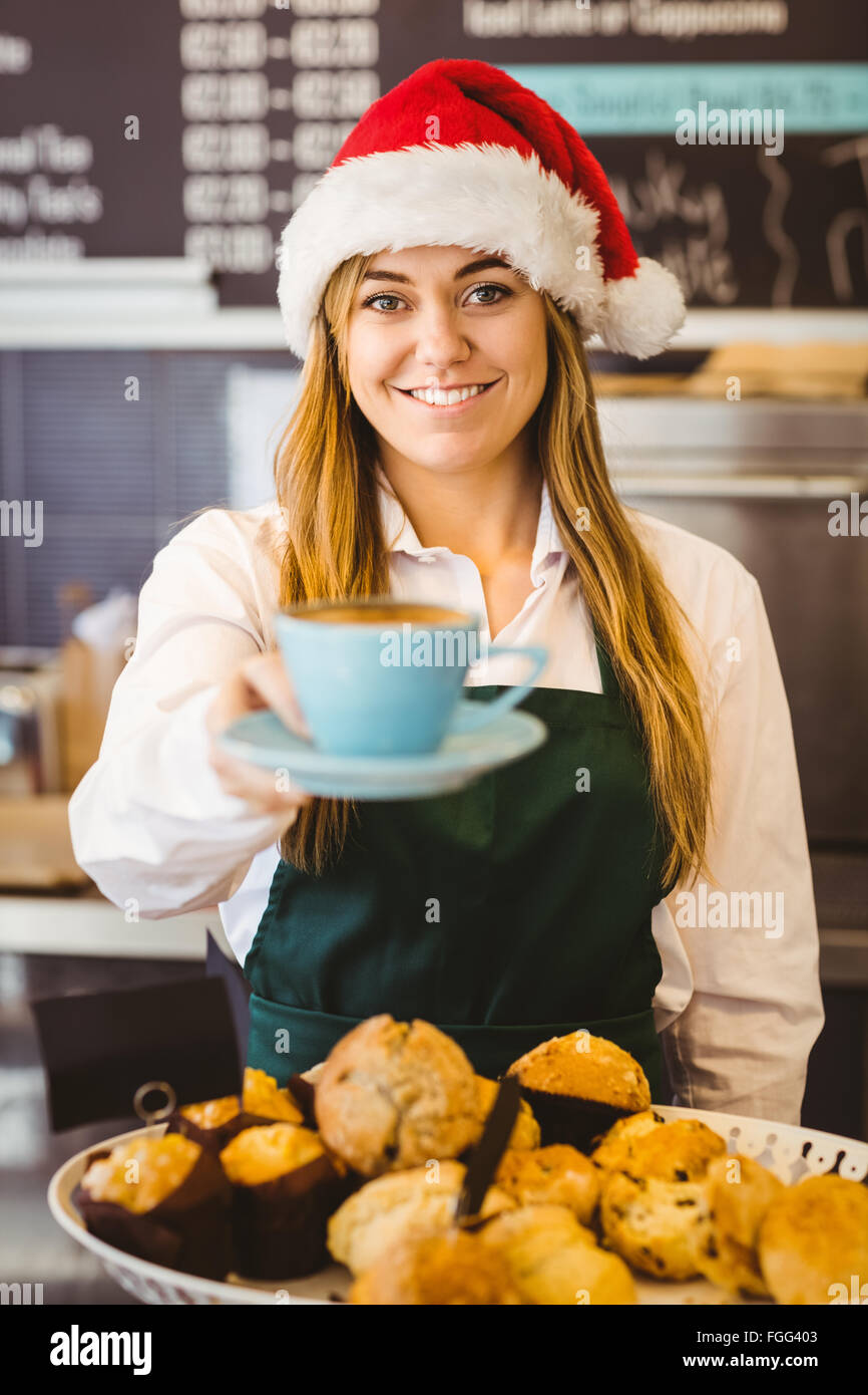 Cute waitress standing behind the counter Stock Photo - Alamy