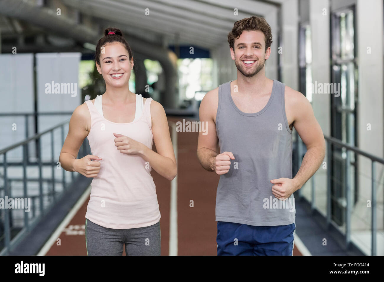 Happy friends running together Stock Photo - Alamy