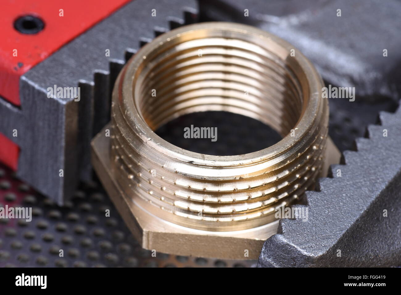 Closeup of brass threaded connector nipple with wrench Stock Photo - Alamy