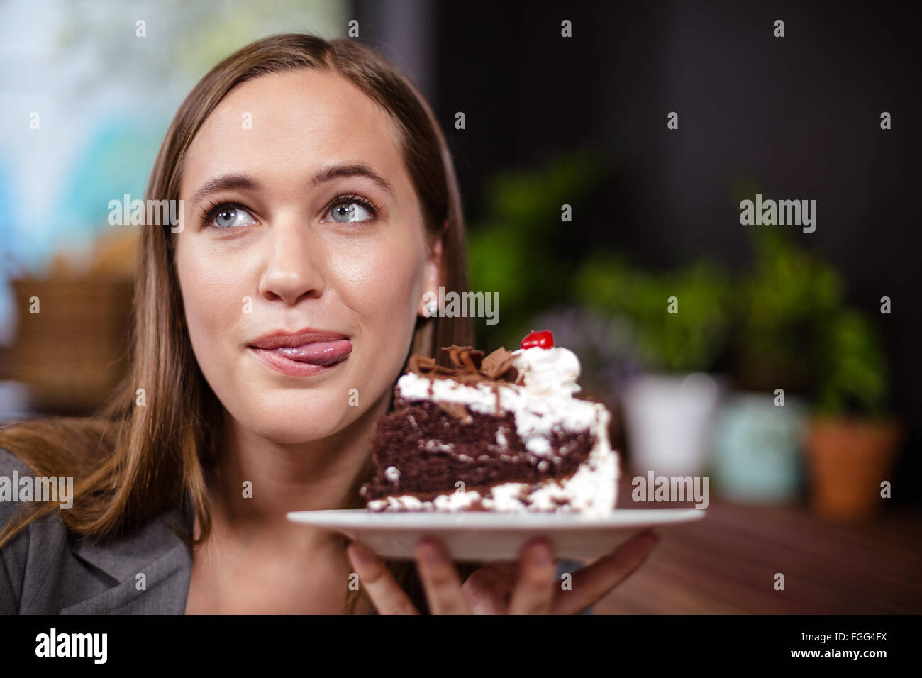 Woman holding piece cake hi-res stock photography and images - Alamy