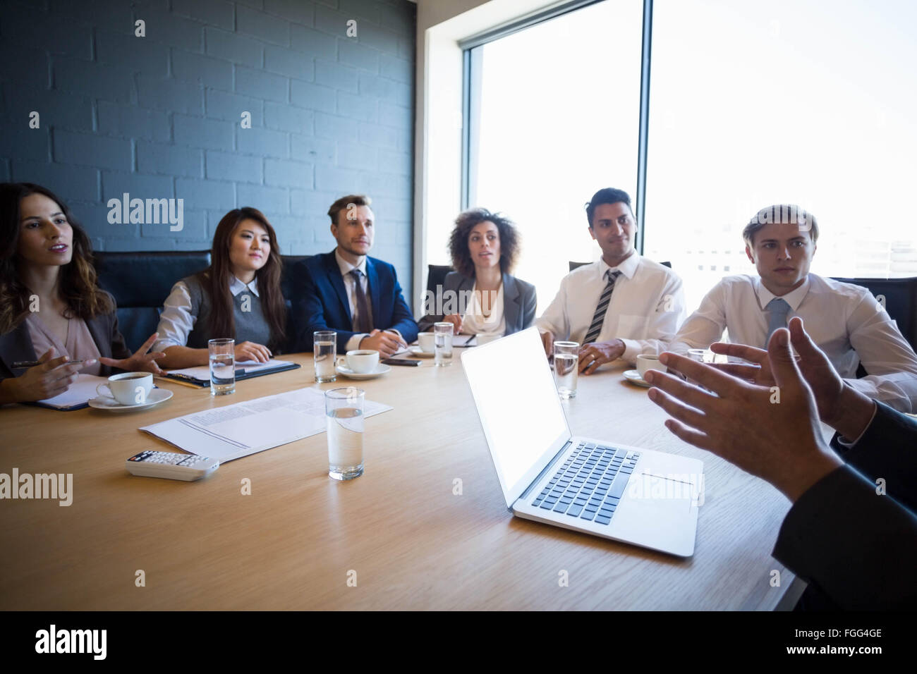 Businesspeople having a discussion in conference room Stock Photo - Alamy