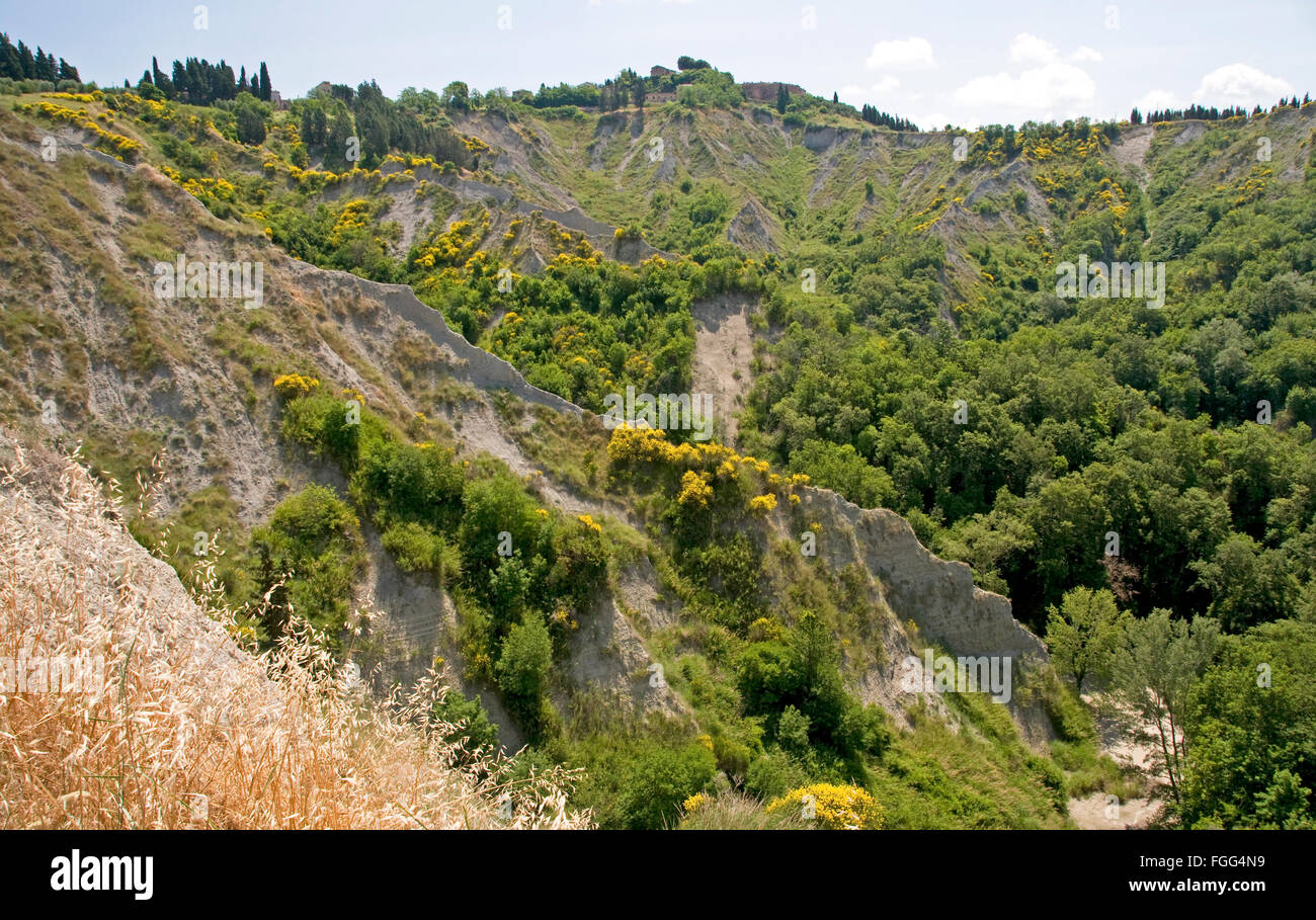 Attractive hills of Le Crete region of Tuscany, with the village of ...