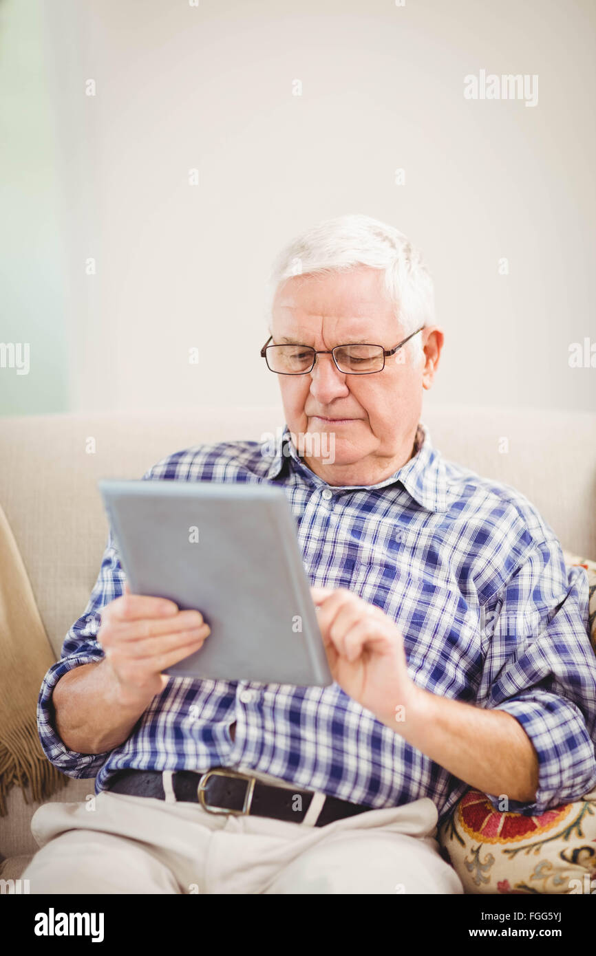 Senior man using digital tablet Stock Photo - Alamy