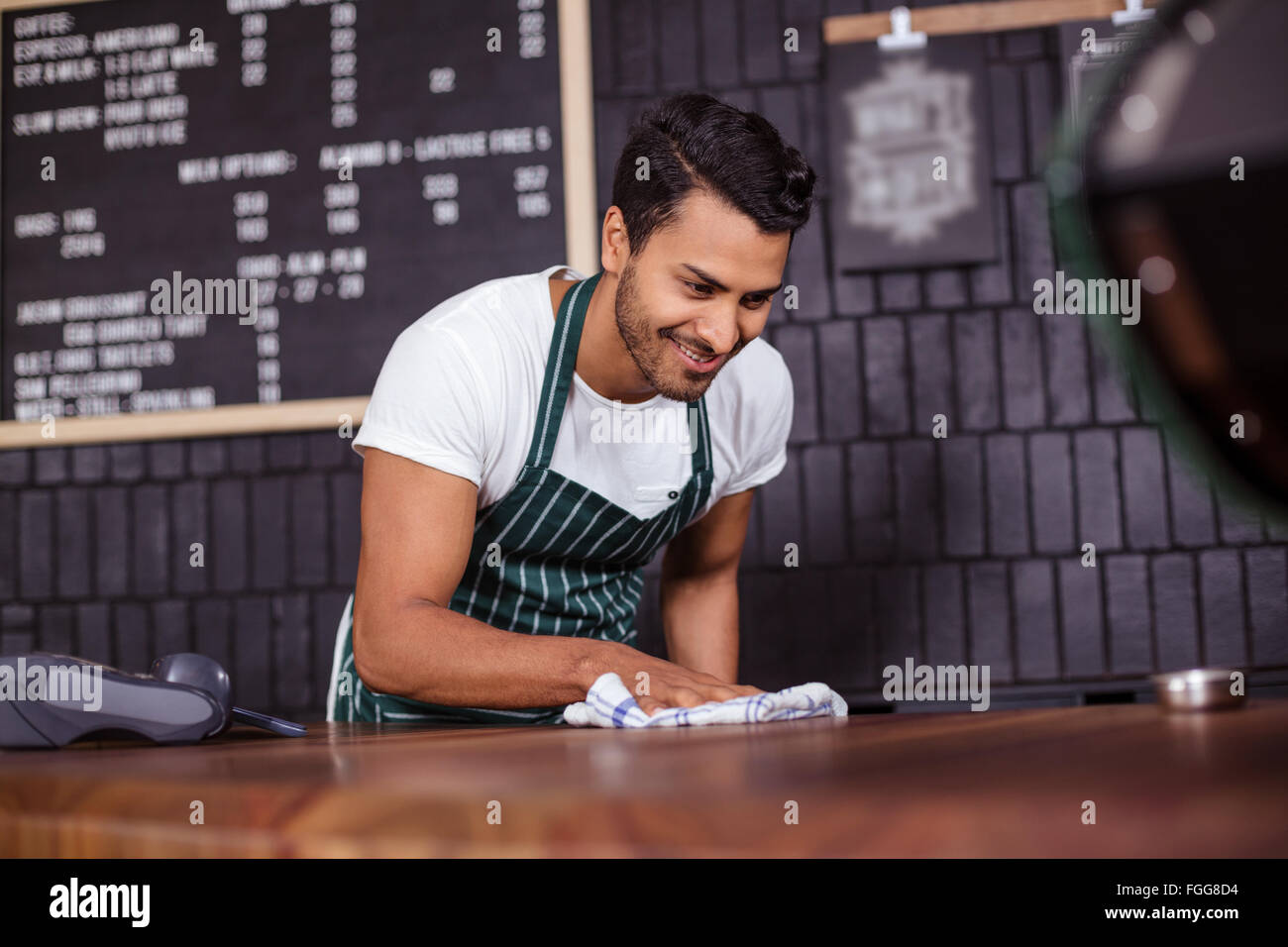 Indian man at retail counter hi-res stock photography and images - Alamy