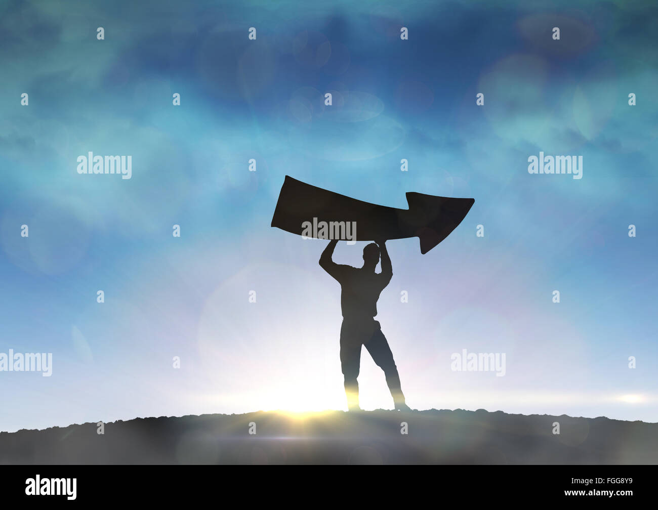 Composite image of businessman holding arrow Stock Photo - Alamy
