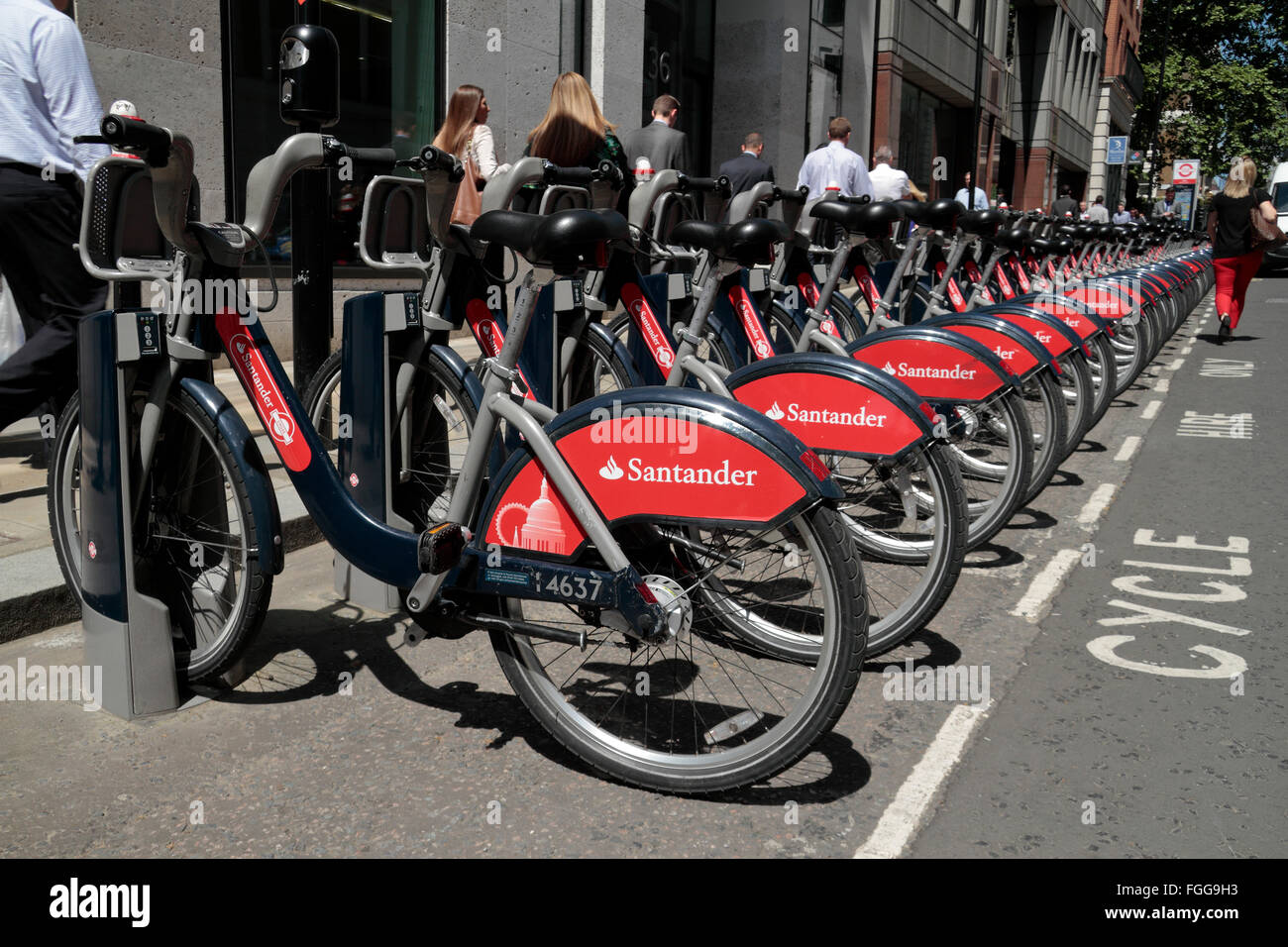 A line of city bicycles sponsored by Santander in the City of London ...