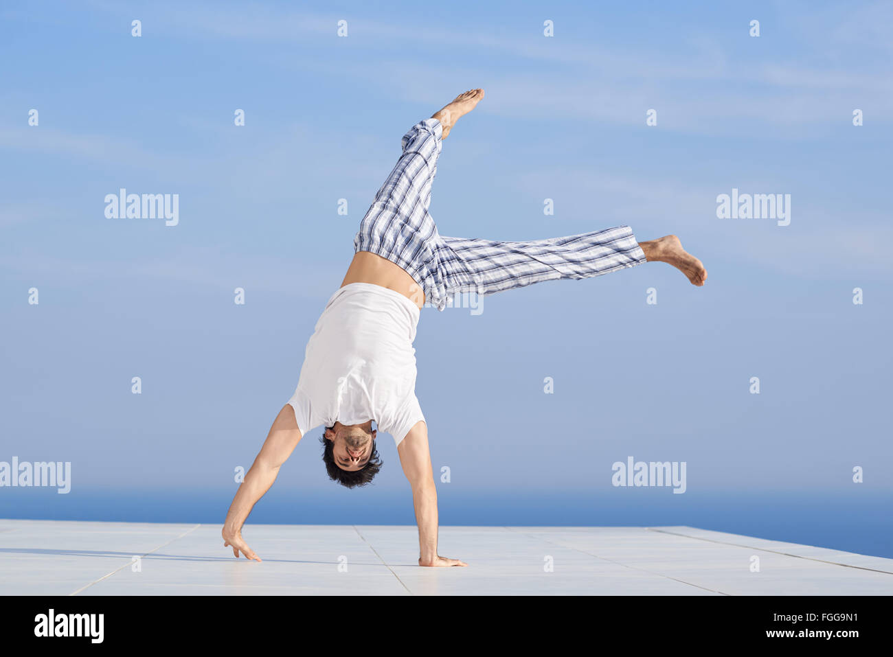 young man practicing yoga Stock Photo - Alamy