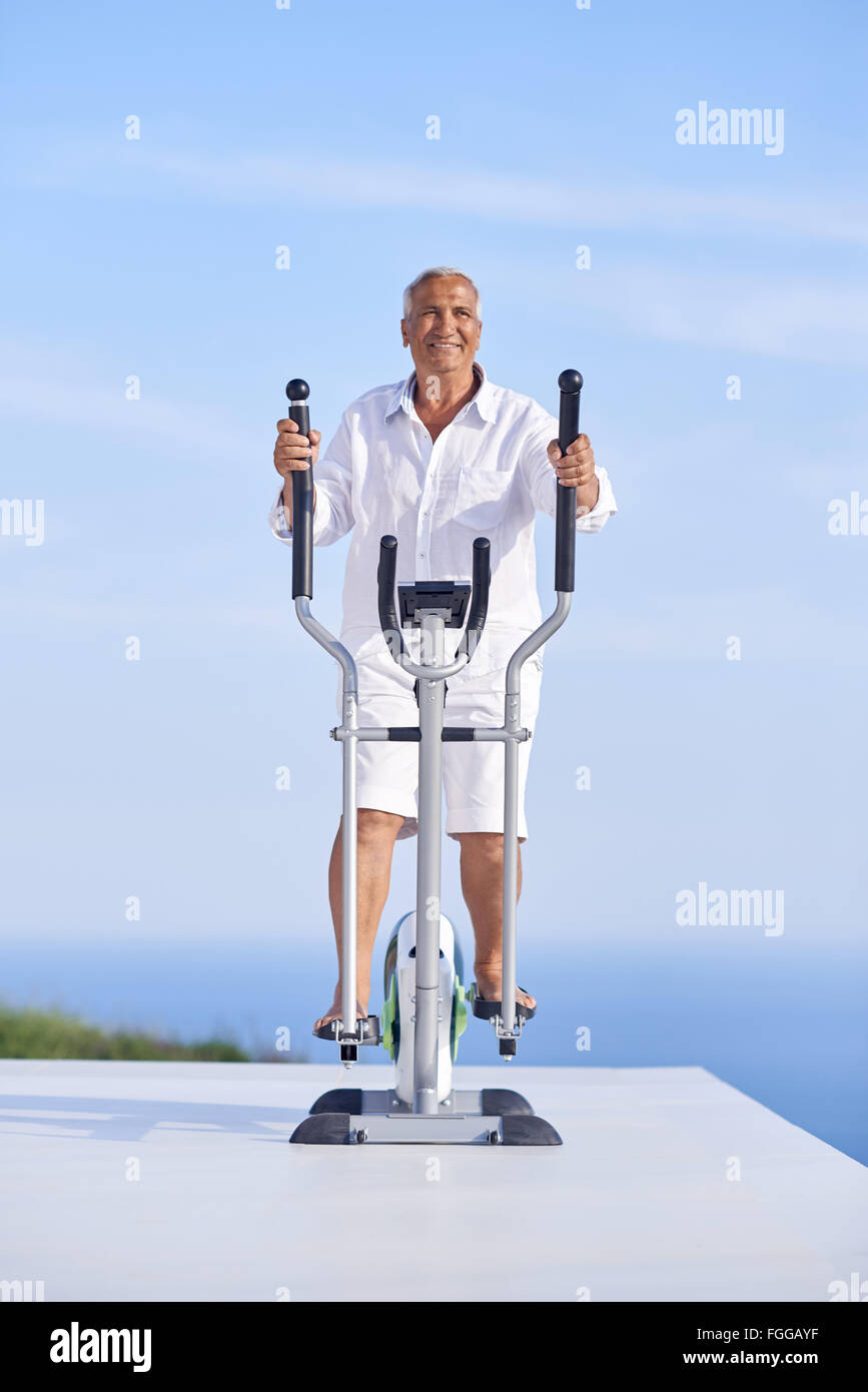 Man 60s working hi-res stock photography and images - Alamy