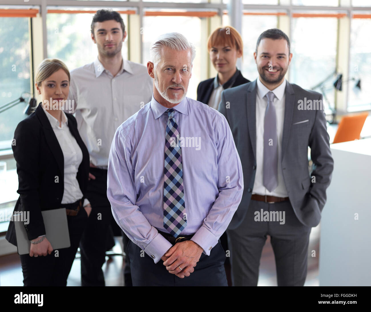 senior business man with his team at office Stock Photo - Alamy