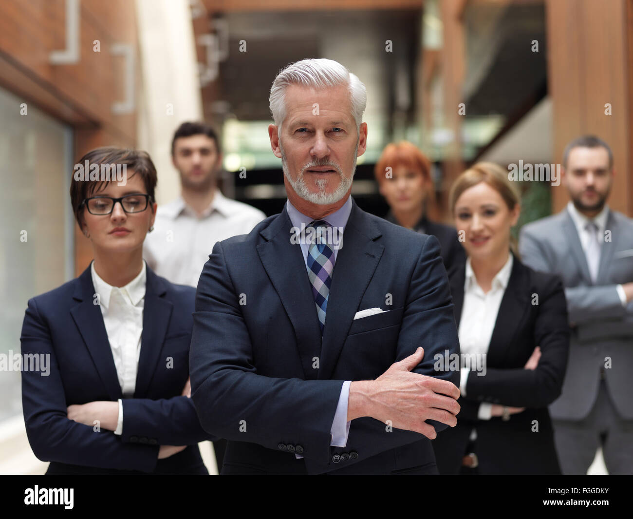 senior business man with his team at office Stock Photo - Alamy