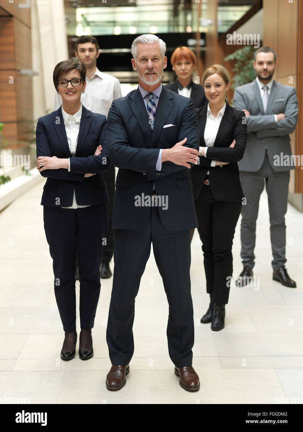 senior business man with his team at office Stock Photo - Alamy