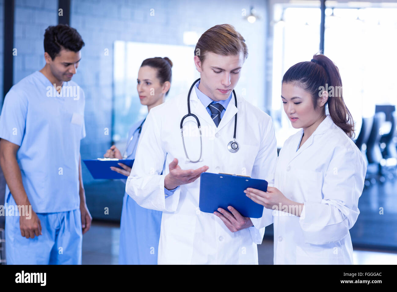 Group happy doctors discussing hi-res stock photography and images - Alamy