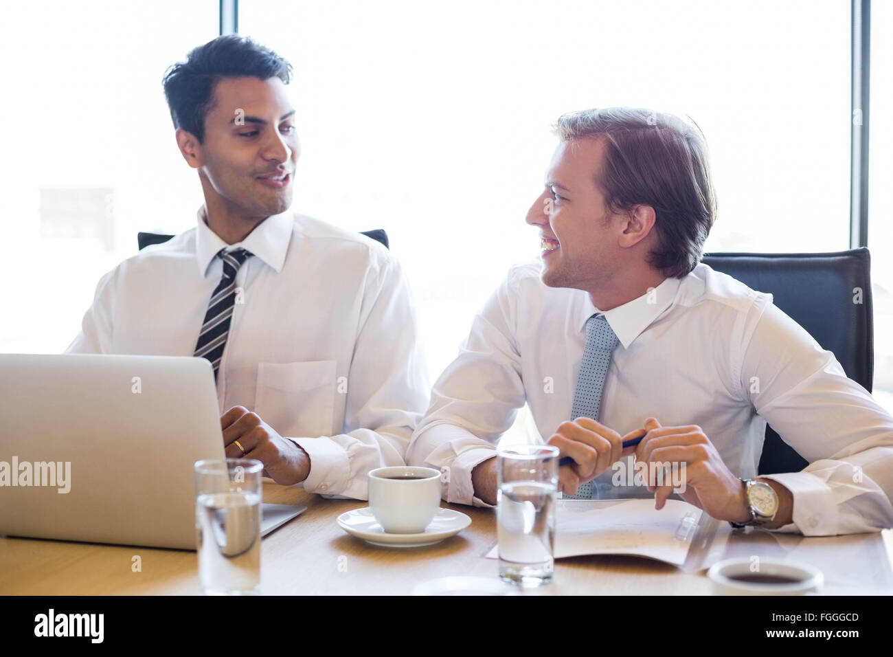 Businesspeople having a discussion in conference room Stock Photo - Alamy
