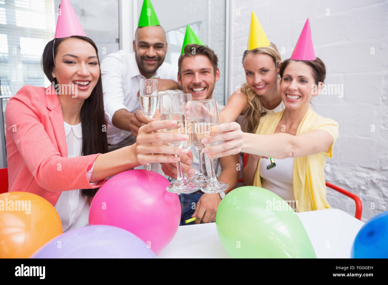 Casual business team toasting with champagne Stock Photo - Alamy