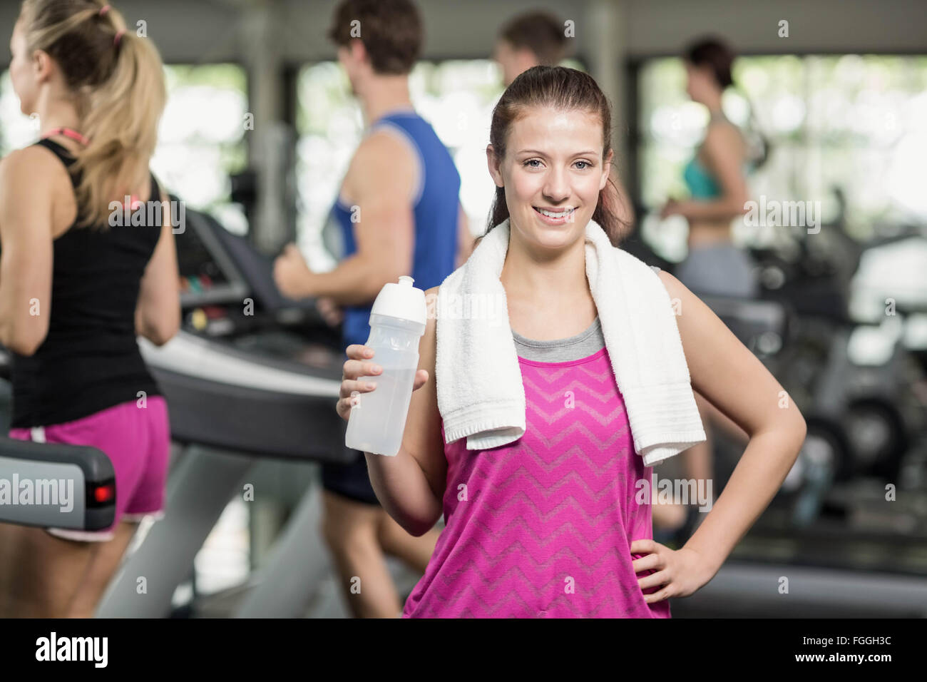 Fit woman posing with hands on hips Stock Photo - Alamy