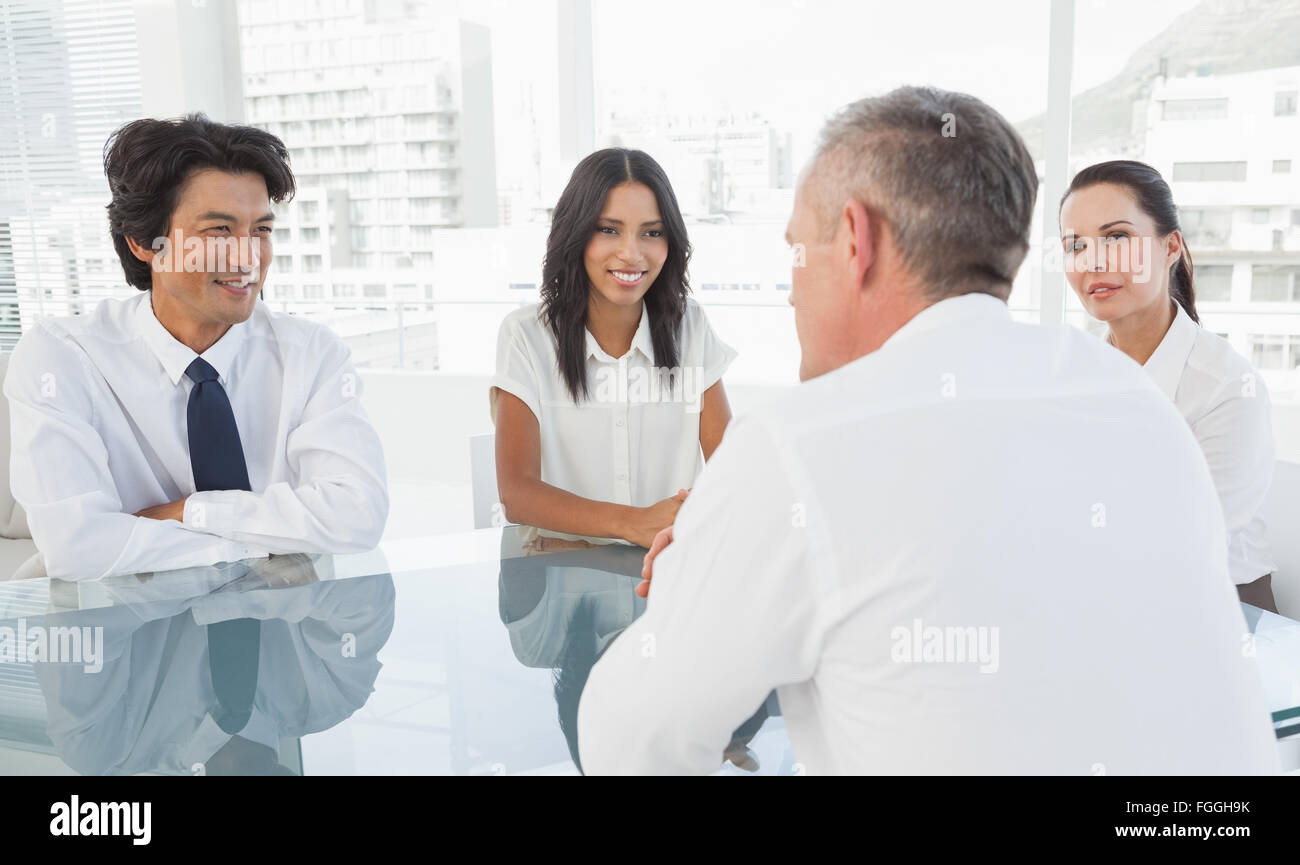 Happy business team talking together Stock Photo - Alamy