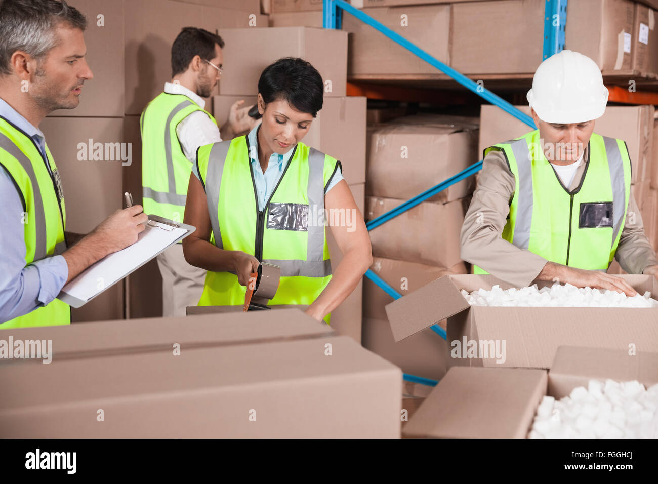 People at work in warehouse Stock Photo - Alamy