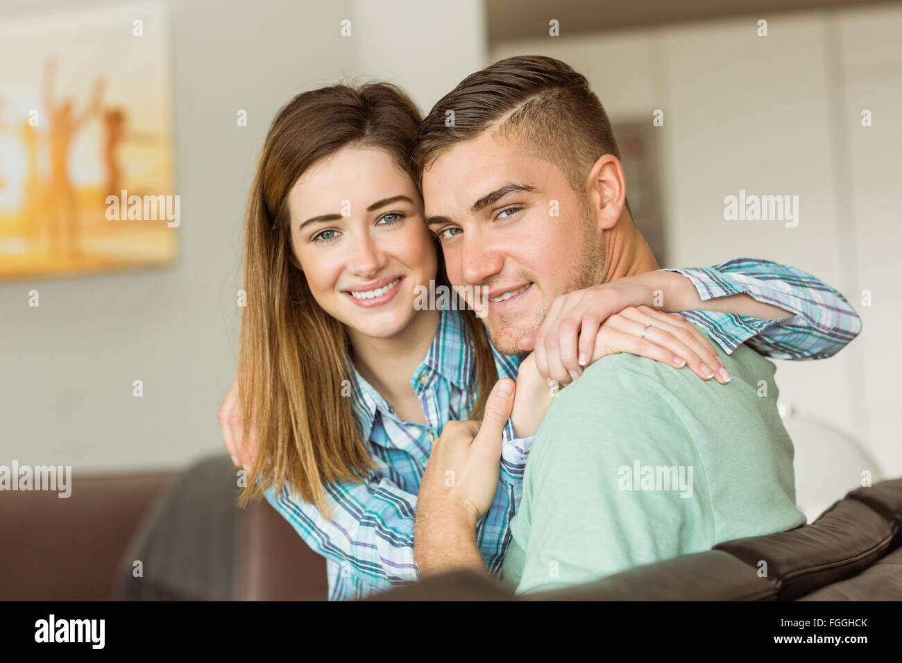 Cute couple relaxing on couch Stock Photo - Alamy