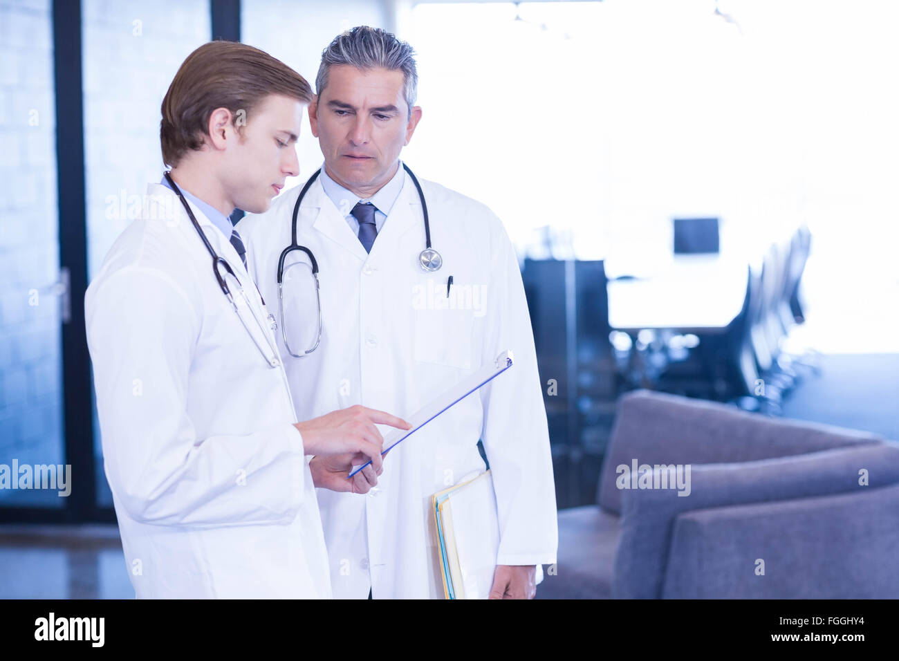 Doctors having a discussion in hospital Stock Photo - Alamy
