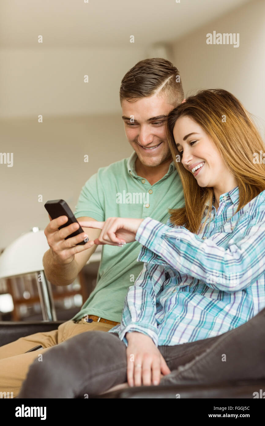 Cute couple relaxing on couch Stock Photo - Alamy