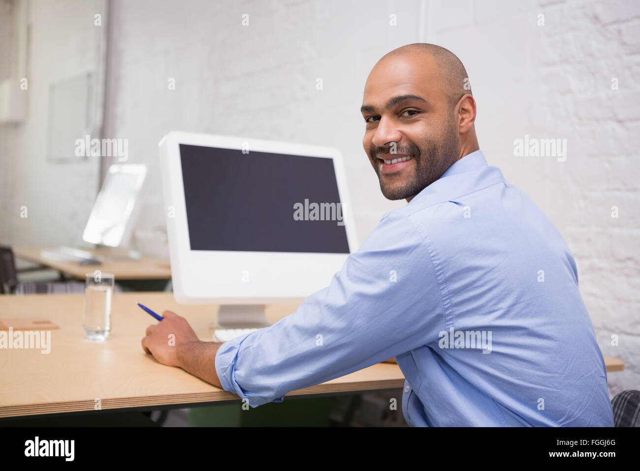 Businessman using computer at desk Stock Photo - Alamy