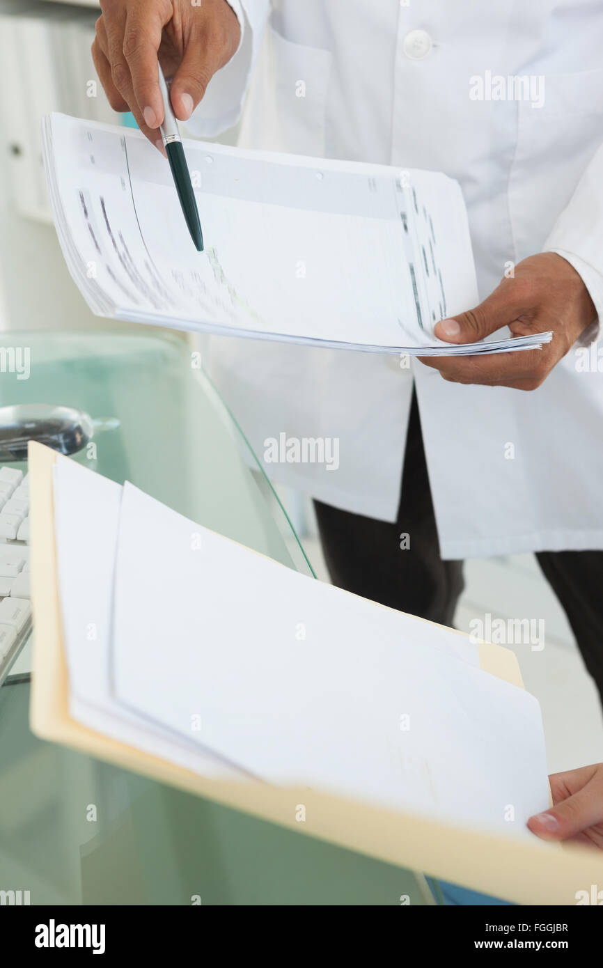 Doctors comparing work notes Stock Photo - Alamy