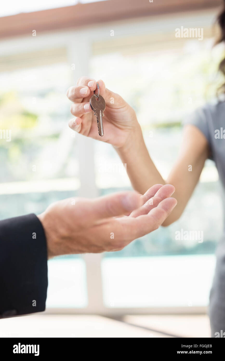 Real-estate agent giving keys Stock Photo - Alamy