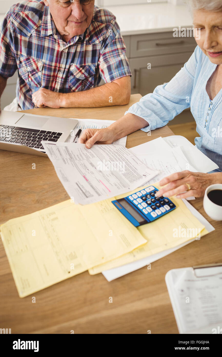 Senior couple checking their bills Stock Photo - Alamy