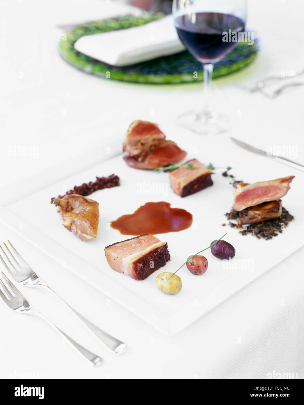 Pan seared squab,braised pork belly, Confit marble fingerling potatoes ...