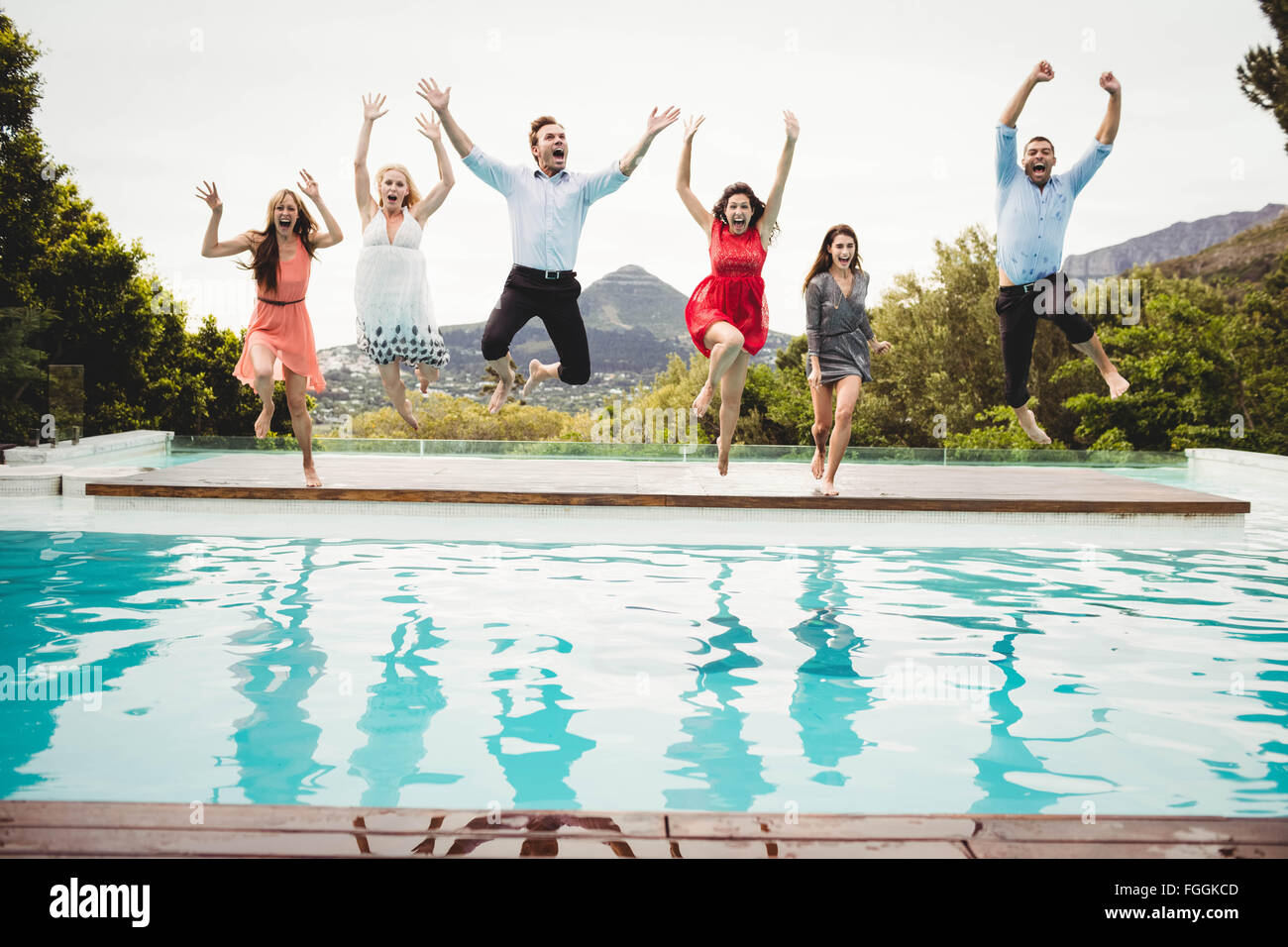 Young friends having fun at swimming pool Stock Photo - Alamy