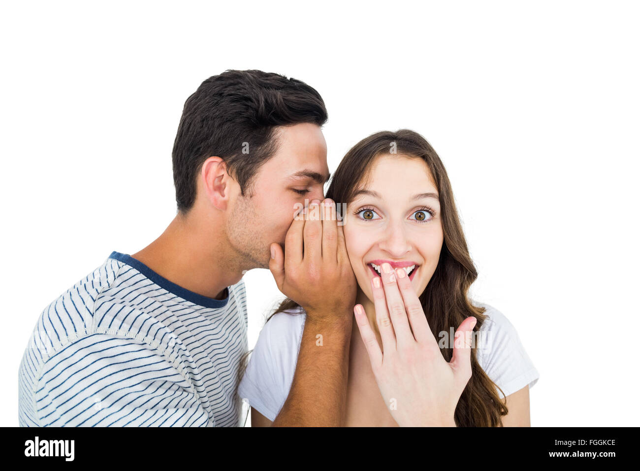 Young couple sharing a secret Stock Photo - Alamy