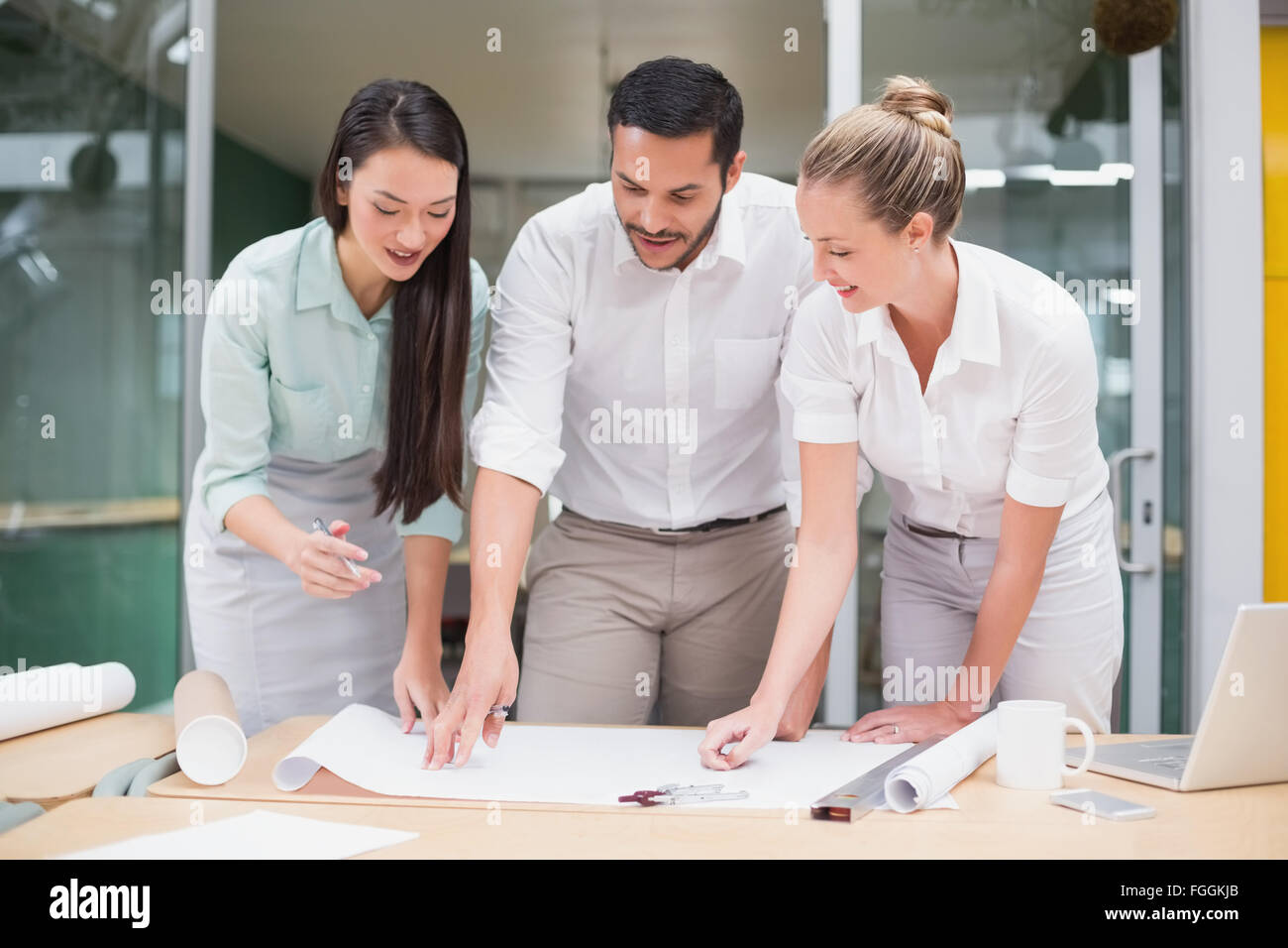 Architecture team working together at desk Stock Photo - Alamy