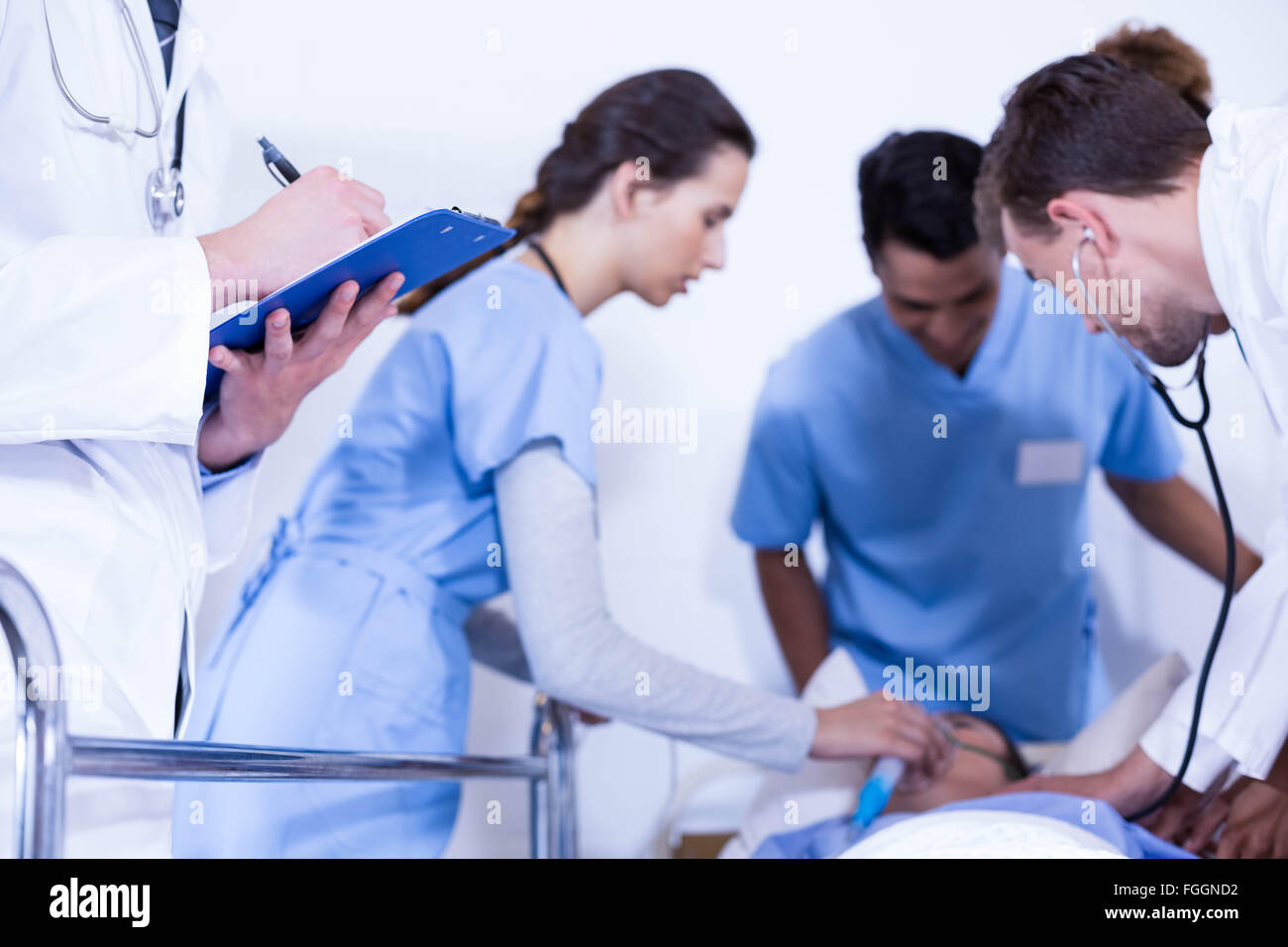 Doctor writing on clipboard Stock Photo - Alamy
