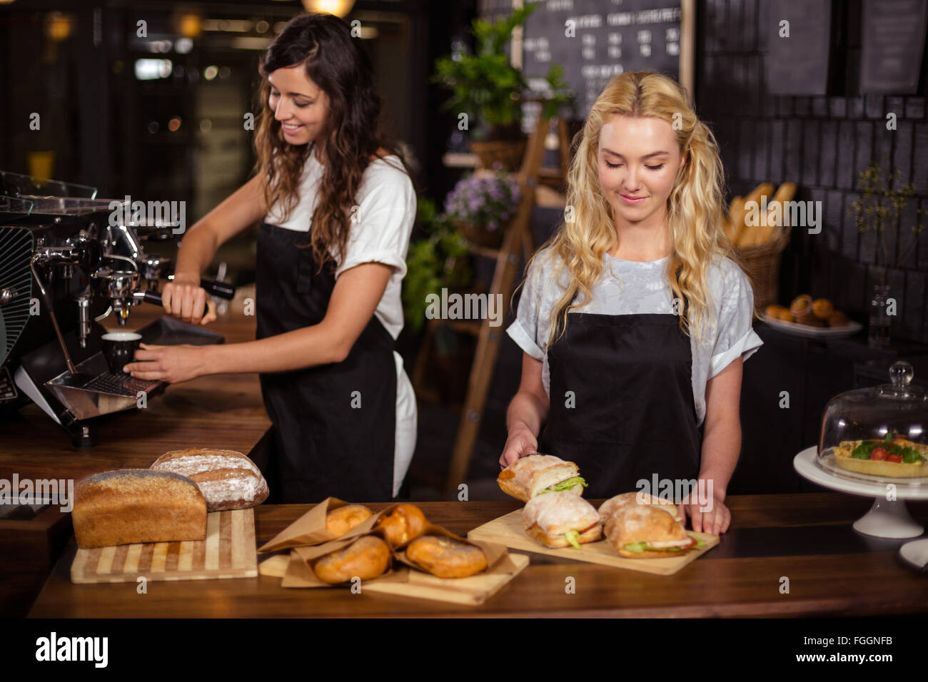 Workers standing behind counter hi-res stock photography and images - Alamy