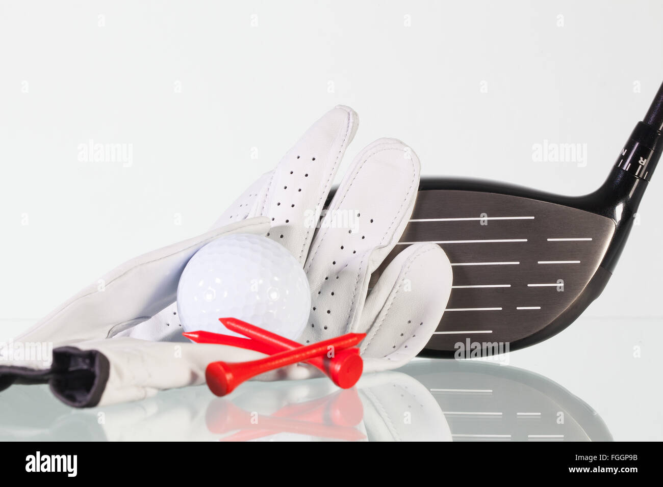 Golf club on a glass desk Stock Photo - Alamy
