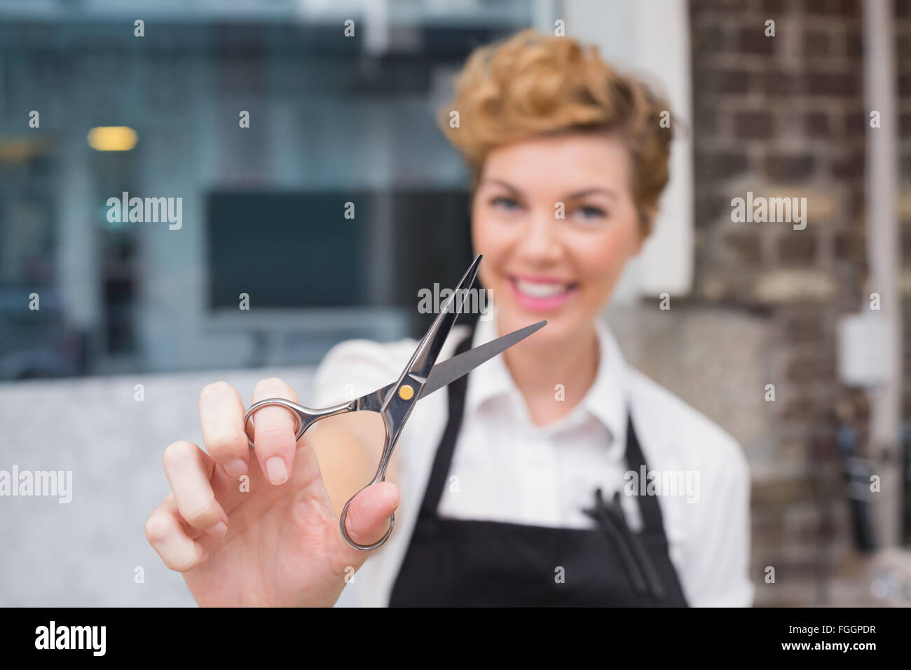 Confident hairdresser smiling at camera Stock Photo - Alamy