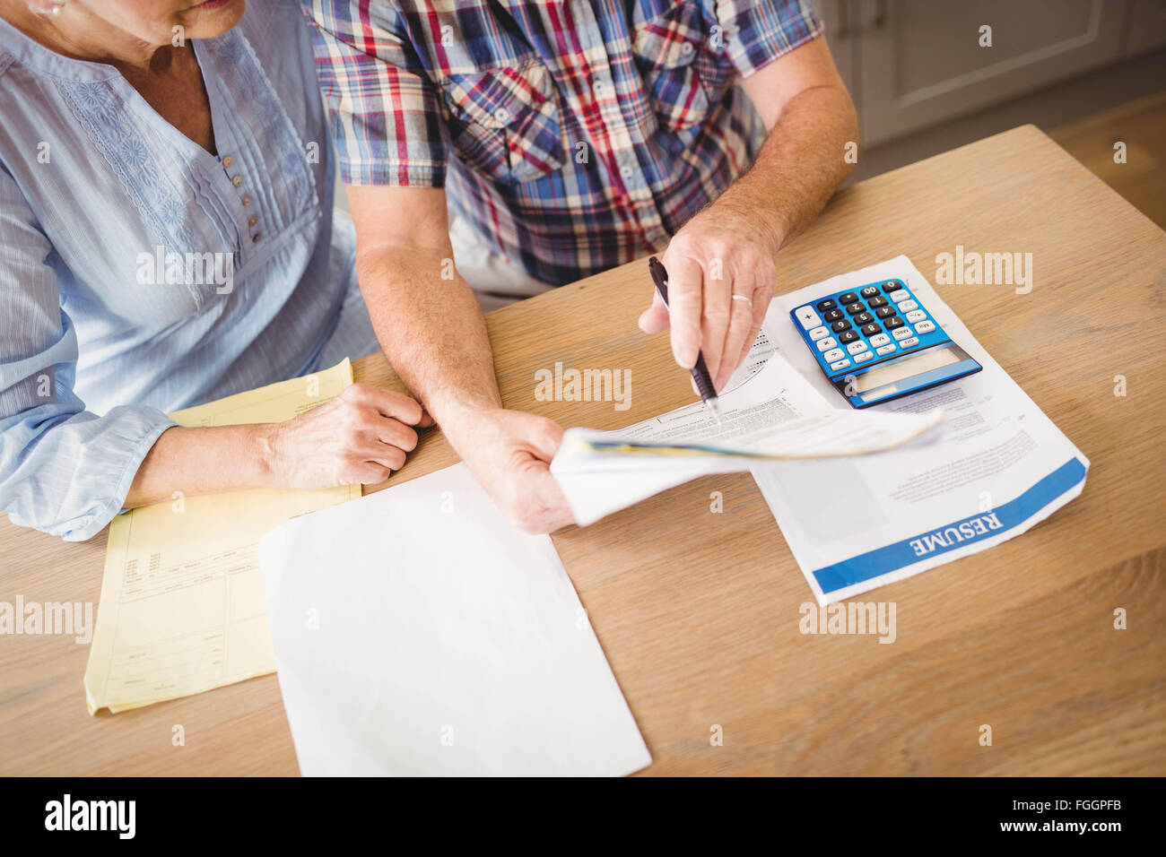 Senior couple checking their bills Stock Photo - Alamy