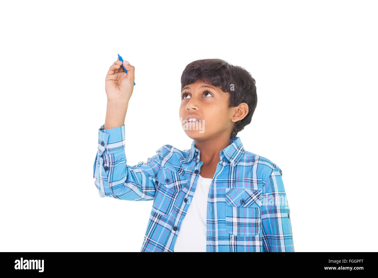 Cute boy smiling and writing Stock Photo - Alamy