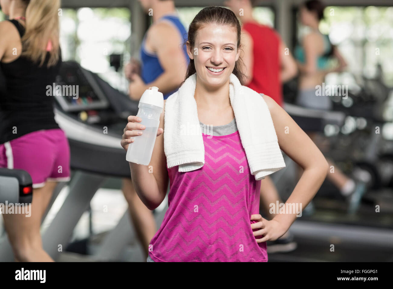 Fit woman posing with hands on hips Stock Photo - Alamy