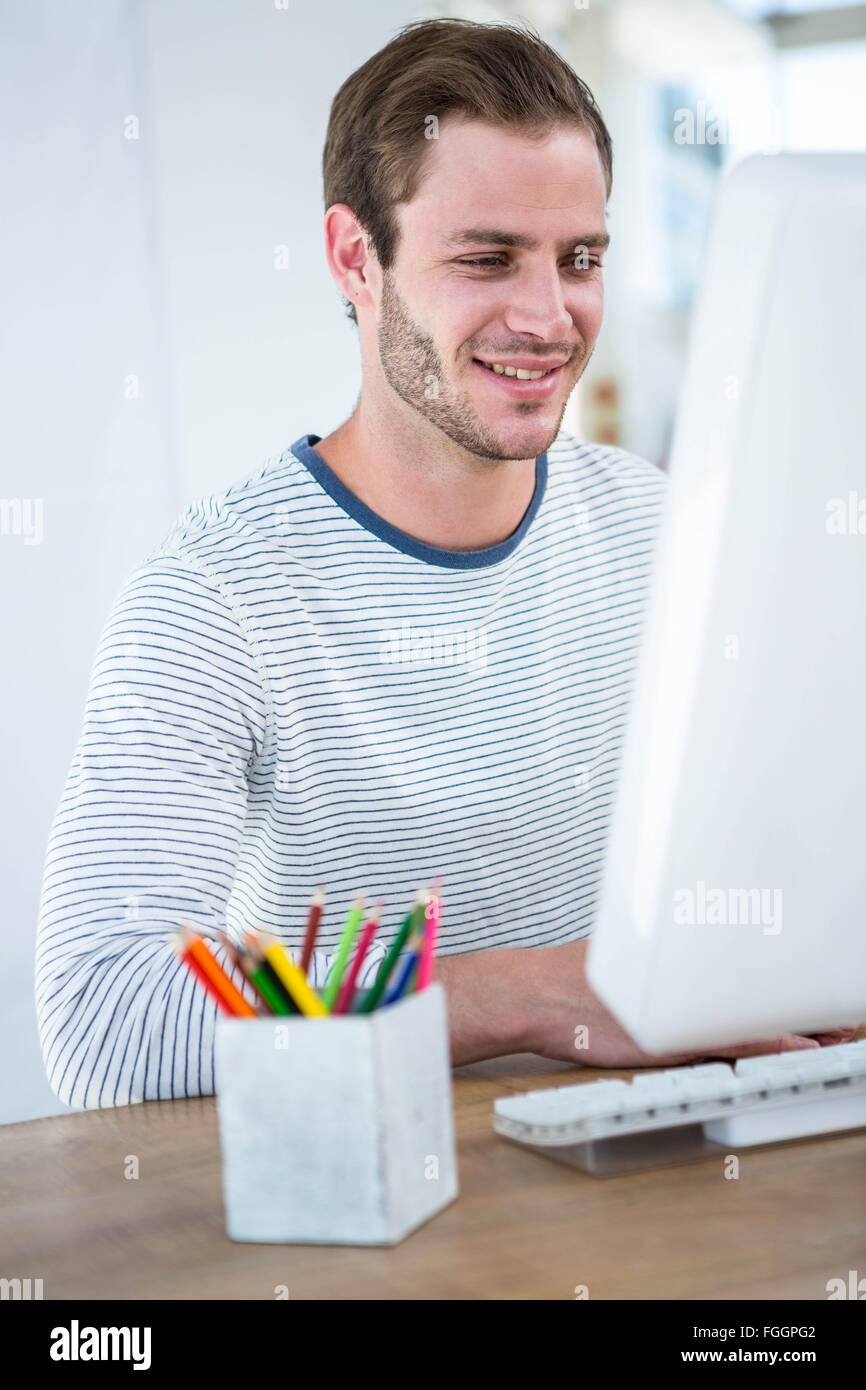 Handsome man working on computer Stock Photo - Alamy