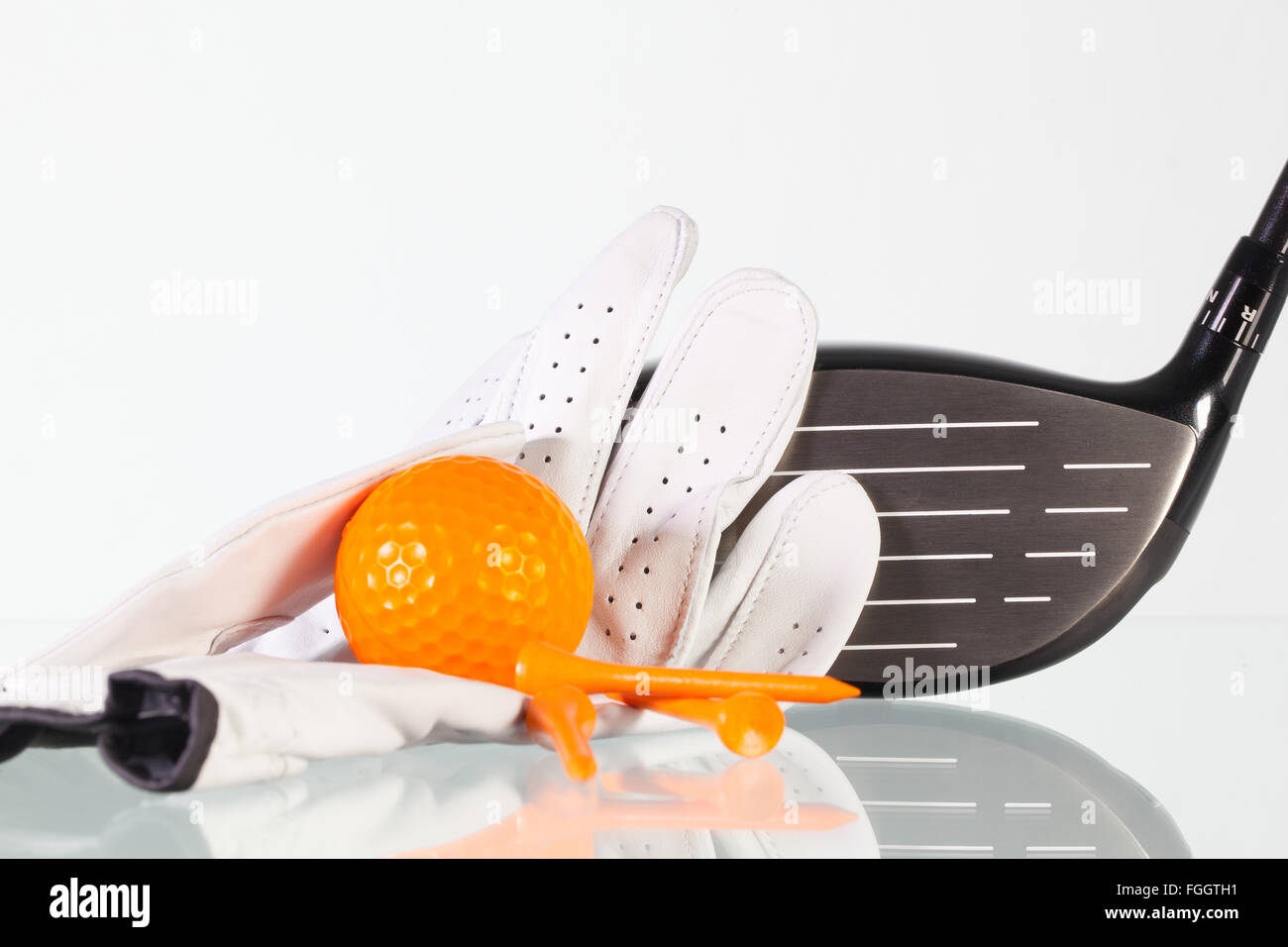 Golf club on a glass desk Stock Photo - Alamy