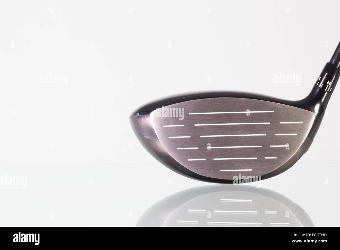 Golf club on a glass desk Stock Photo - Alamy