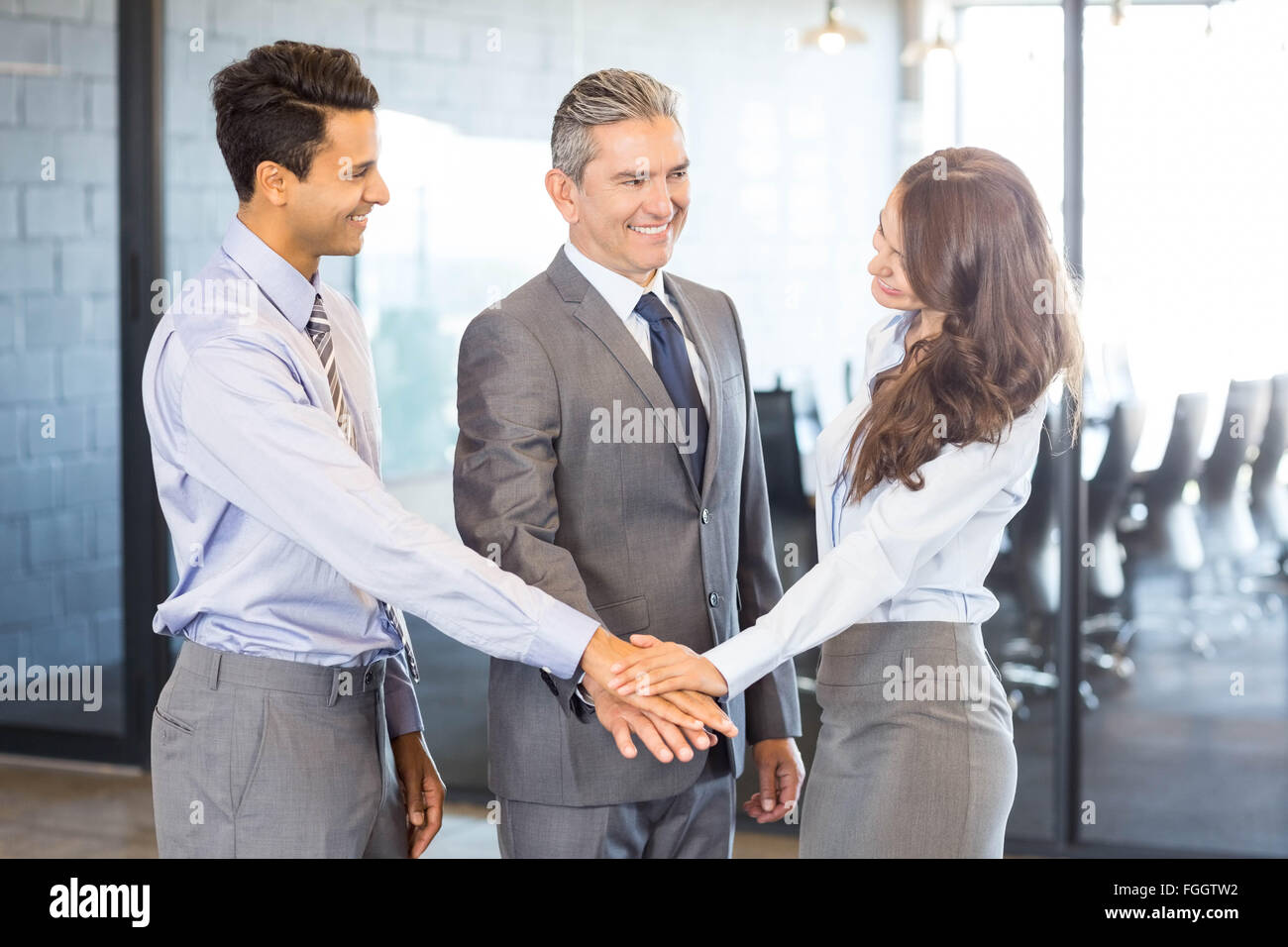 Businesspeople hands stacked over each other Stock Photo - Alamy