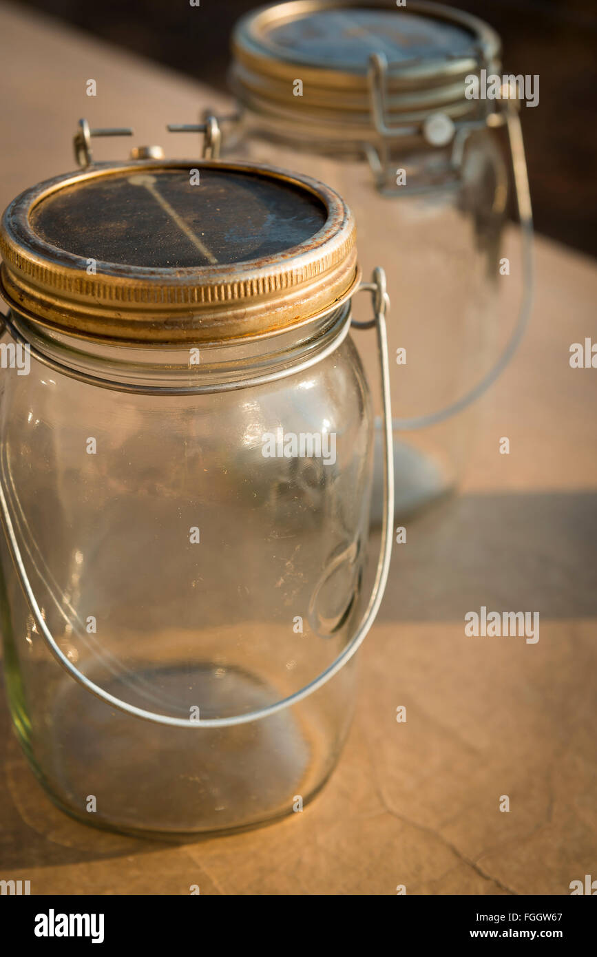 Mason jars with solar power panels powering an LED light under the lid ...