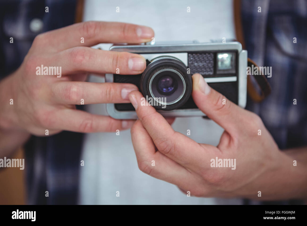 View of masculine hands holding a retro camera Stock Photo - Alamy