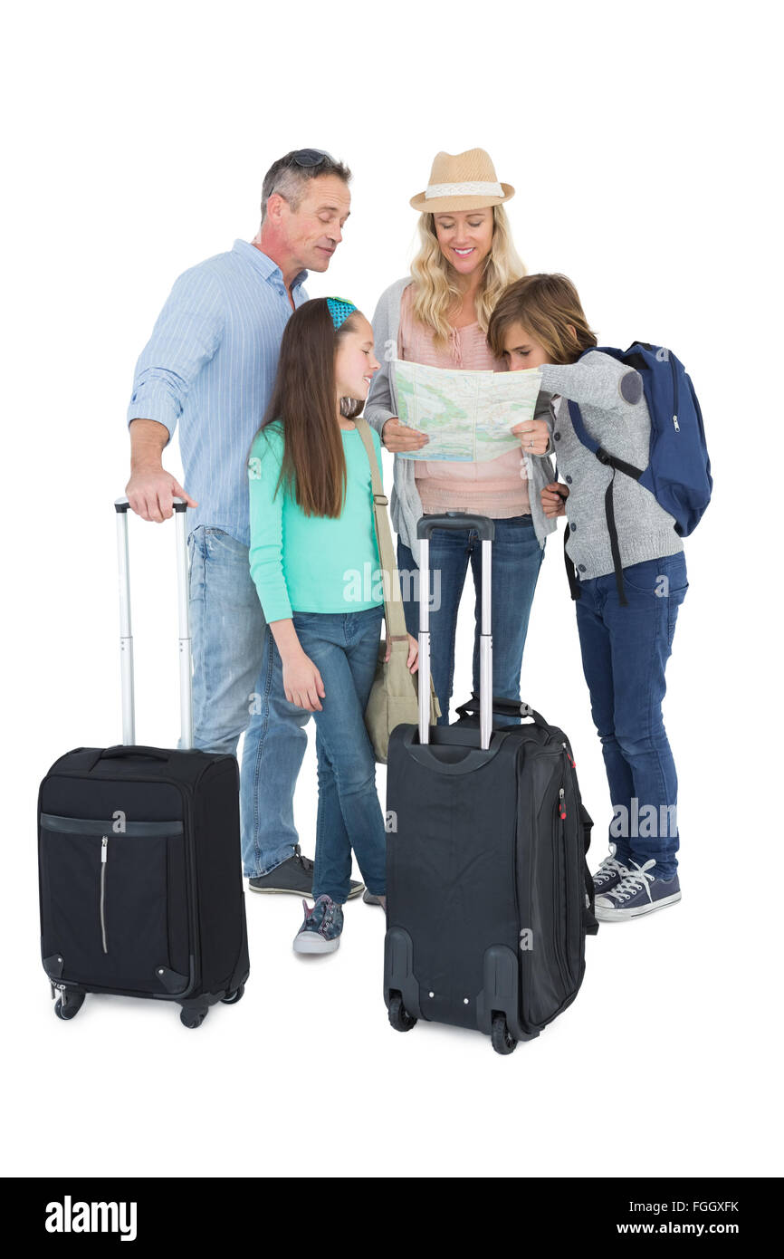 Tourist family consulting the map Stock Photo - Alamy