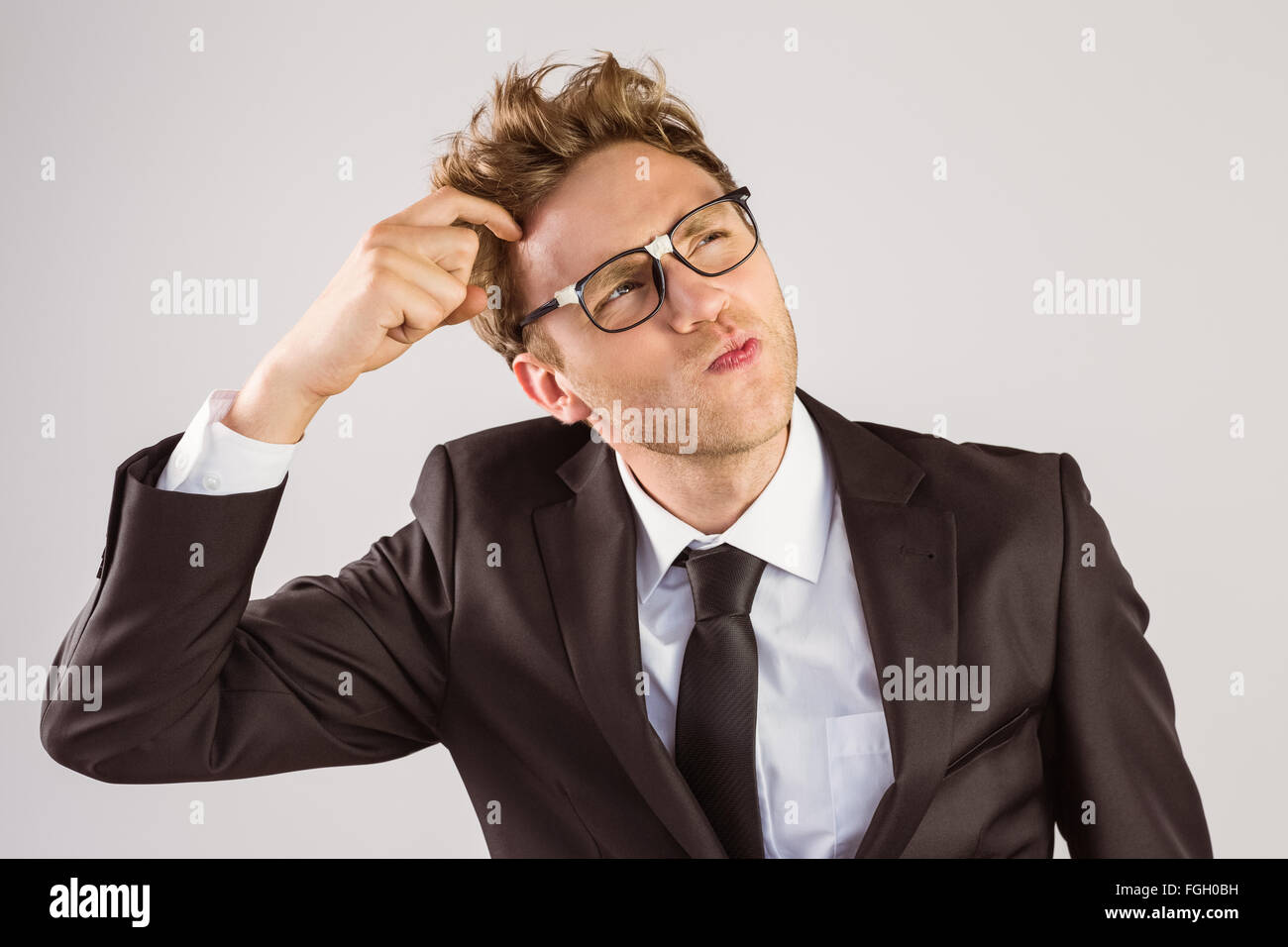 Man suit scratching head hi-res stock photography and images - Alamy