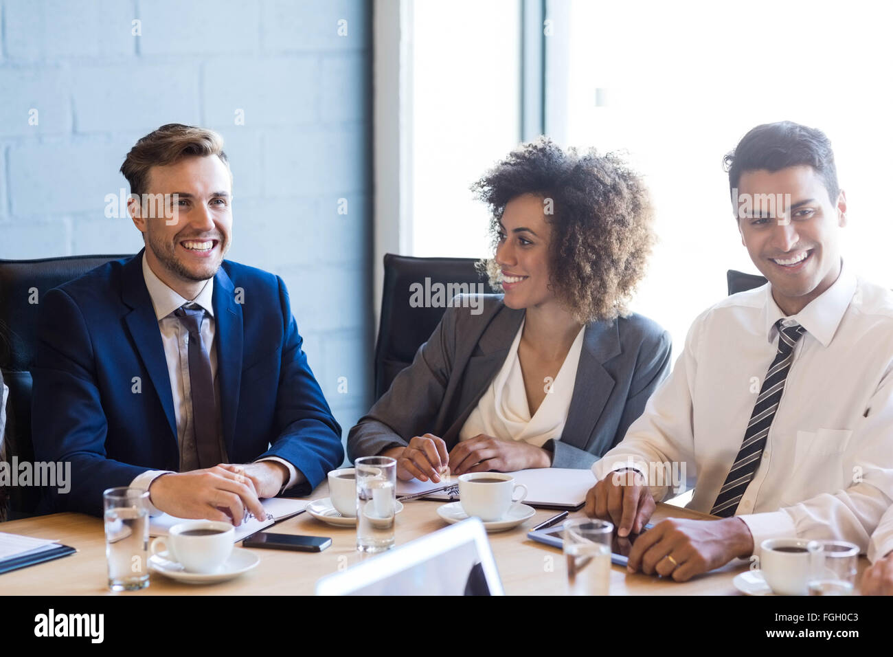 Businesspeople having a discussion in conference room Stock Photo - Alamy